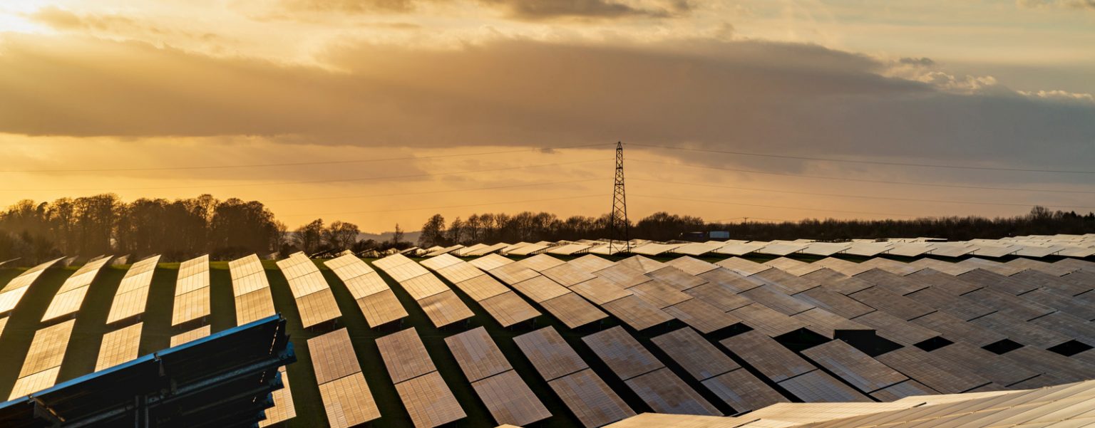 How can GIS help assess the suitability of solar farm sites?